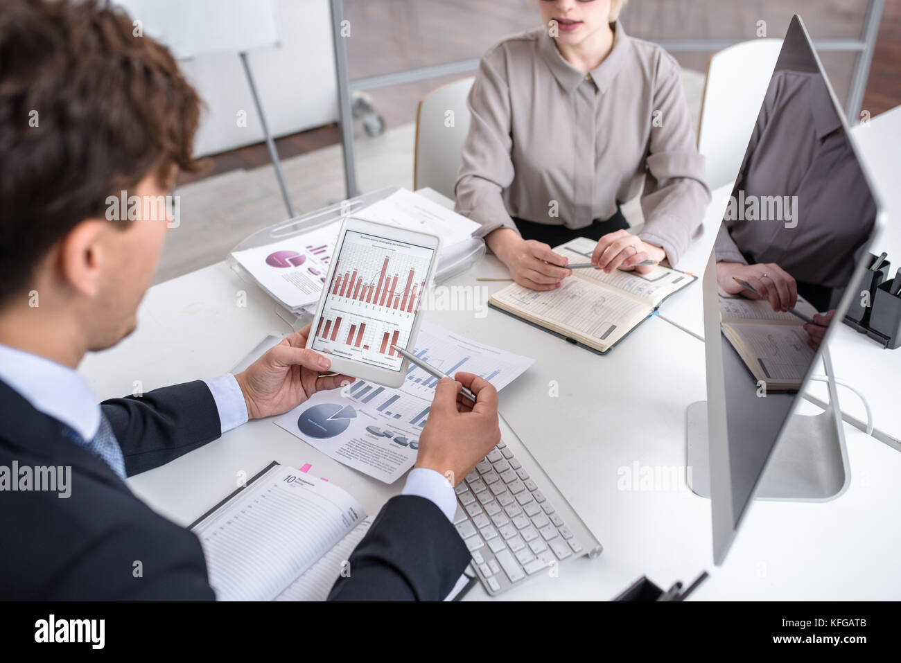 Business People Analyzing Marketing and Finance Report Stock Photo - Alamy
