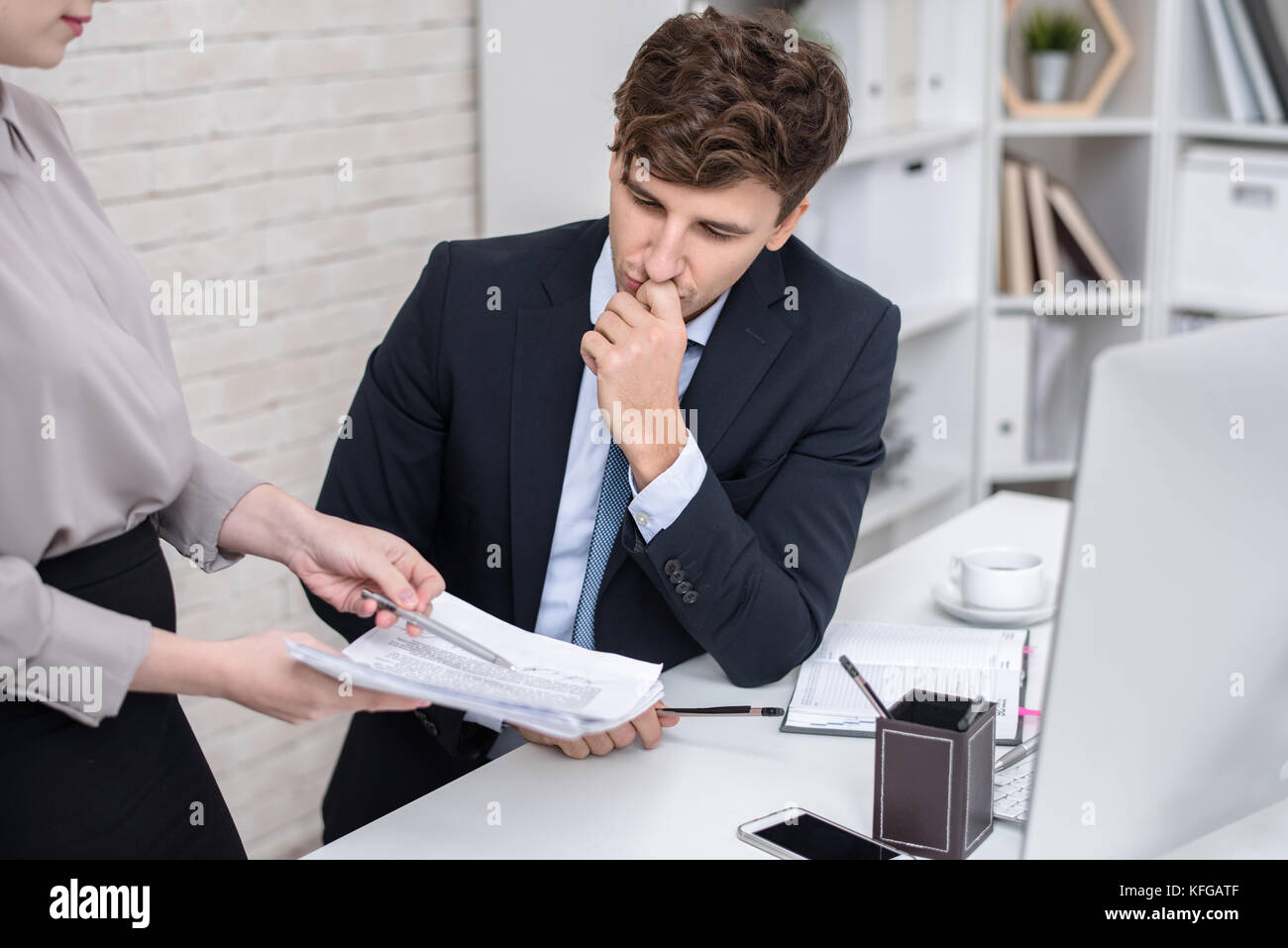 Boss Reading Financial Report Stock Photo - Alamy