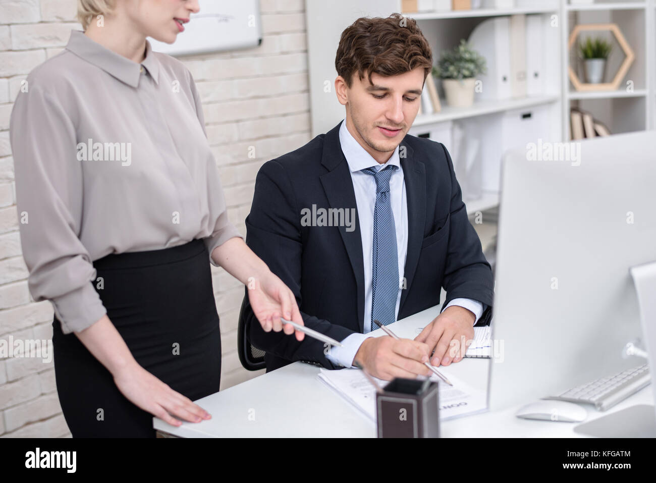 Woman desk signing documents hi-res stock photography and images - Alamy