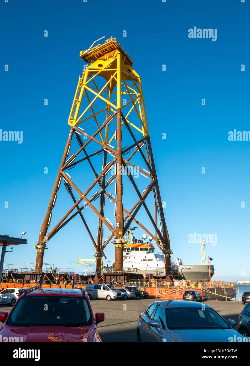 Towering subsea wind farm turbine platform on Boskalis barge prior to ...