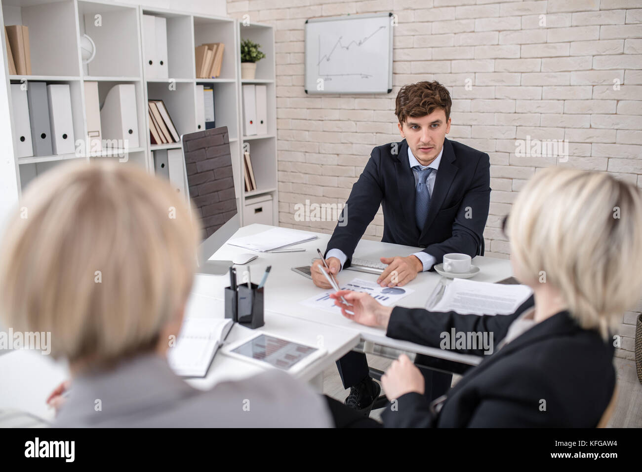 Handsome Man Leading Important Business Meeting in Office Stock Photo ...