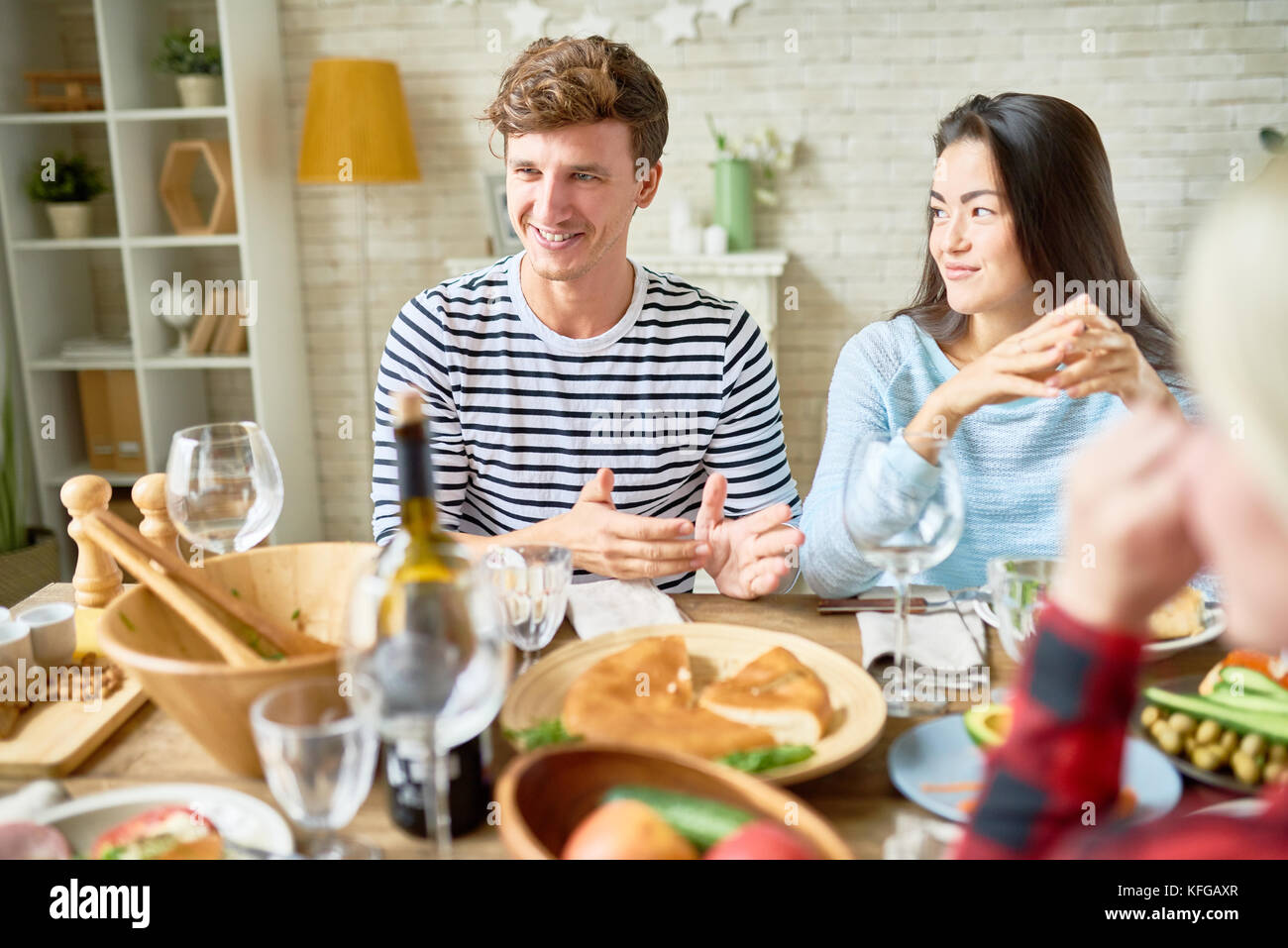 Happy Couple at Dinner Table Stock Photo - Alamy