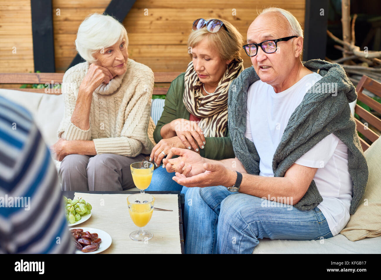 Gathering of Friends at Outdoor Cafe Stock Photo - Alamy