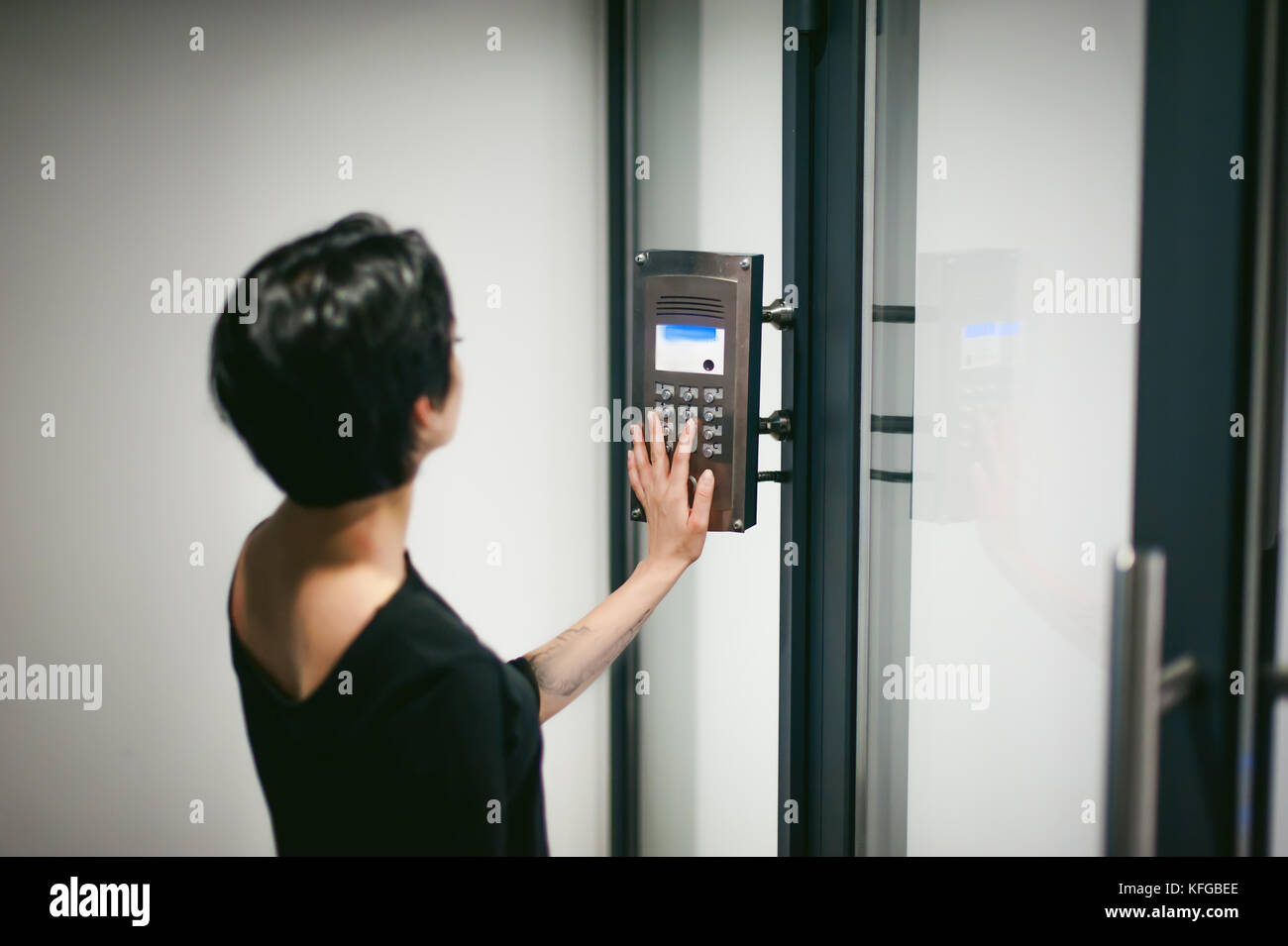 Woman young intercom system hi-res stock photography and images - Alamy