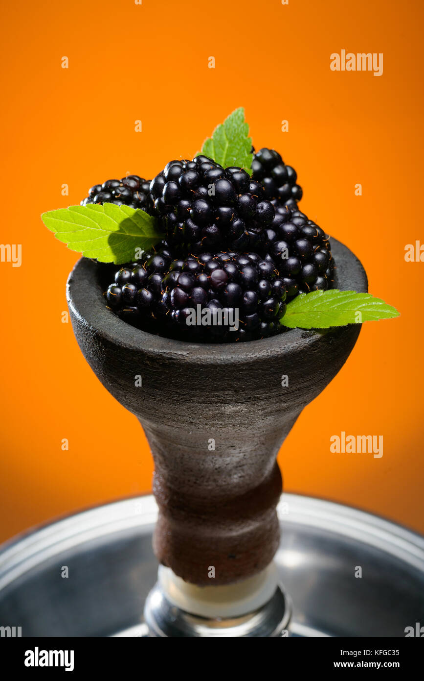 Closeup of hookah head filled with berries Stock Photo - Alamy