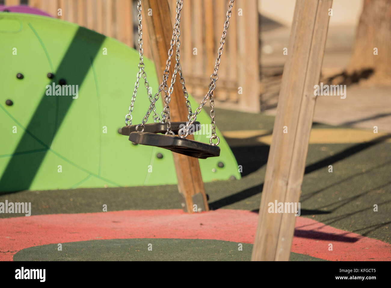 Swing on a playground for children Stock Photo - Alamy