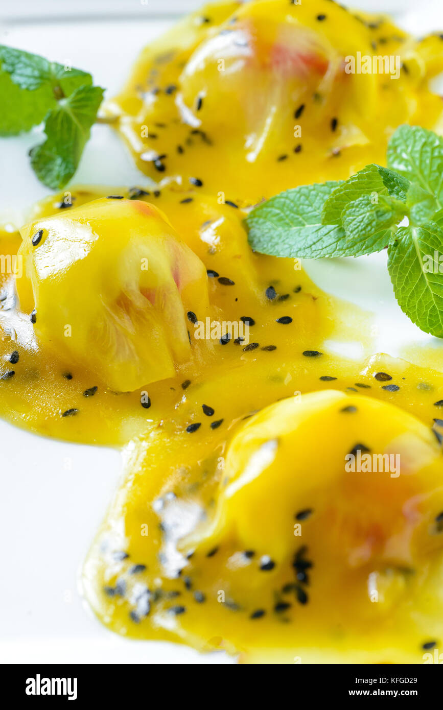 Sweet ravioli with strawberry and sweet sauce Stock Photo - Alamy