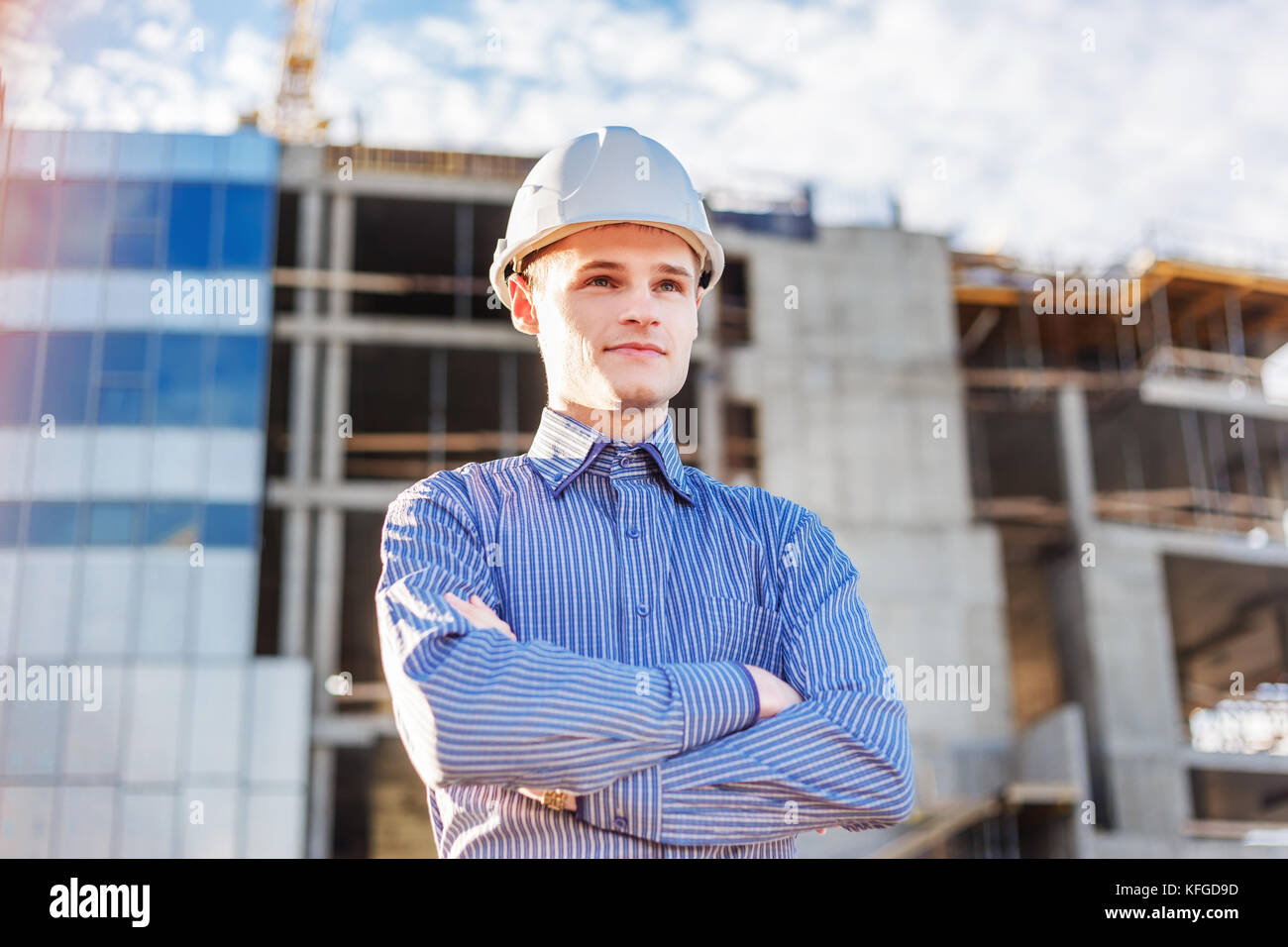 Portrait of a foreman on construction background Stock Photo - Alamy