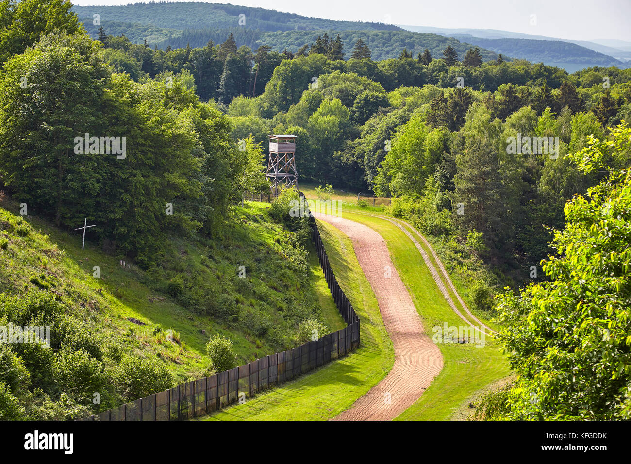 Sentry post, steel mesh fence and perimeter path of the former East ...