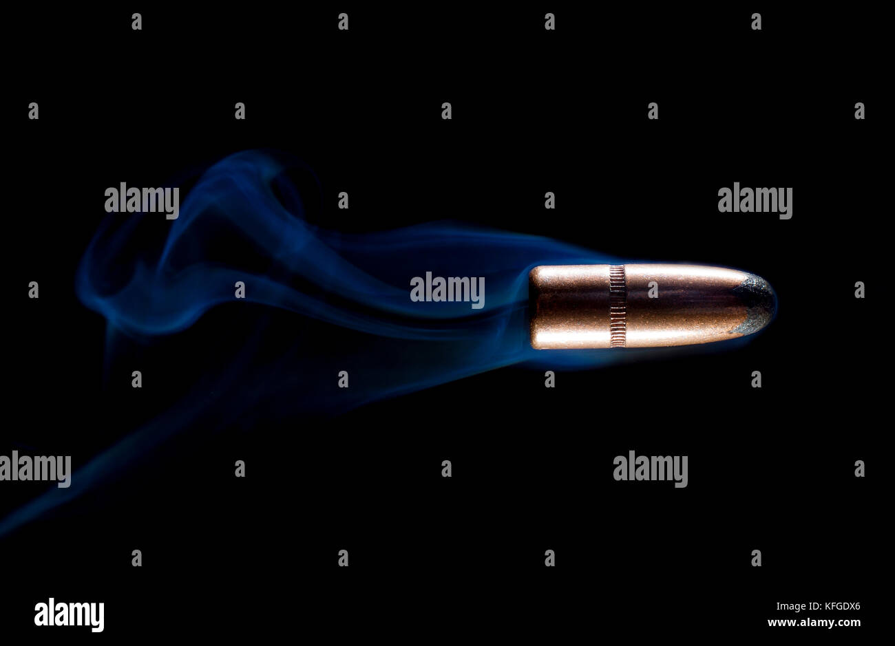 Blue smoke behind a bullet on a black background Stock Photo - Alamy