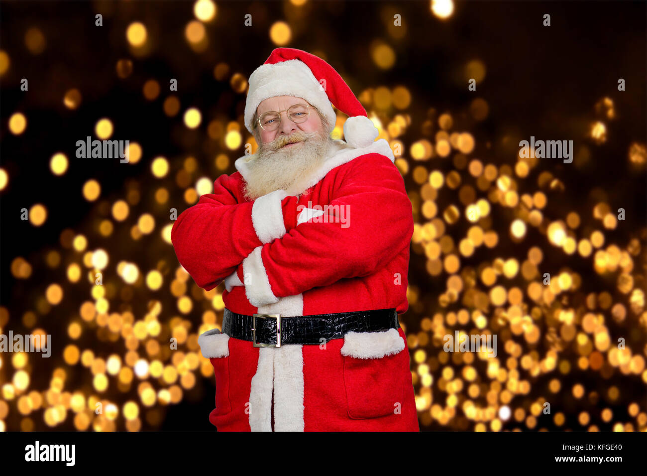 Aged Santa Claus with crossed arms. Santa Claus with real beard and ...
