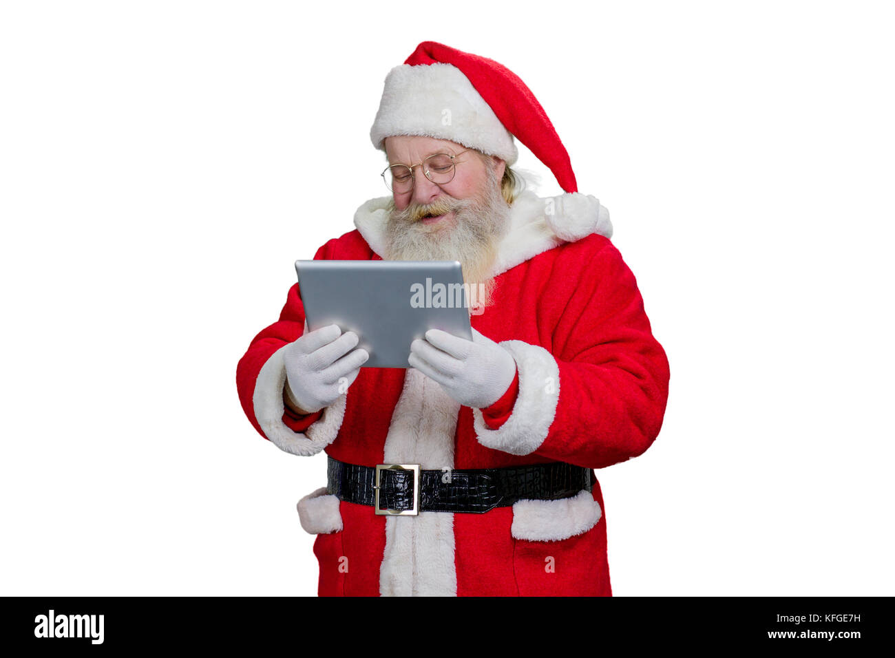 Santa Claus using pc tablet. Senior Santa Claus looking at digital ...