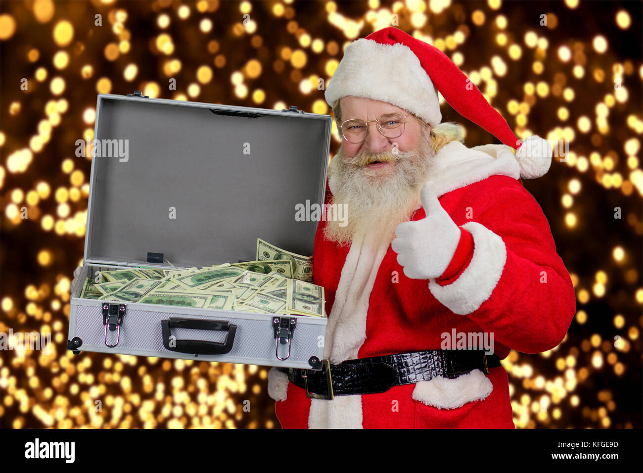 Cheerful Santa Claus with case of money. Happy Santa Claus holding ...
