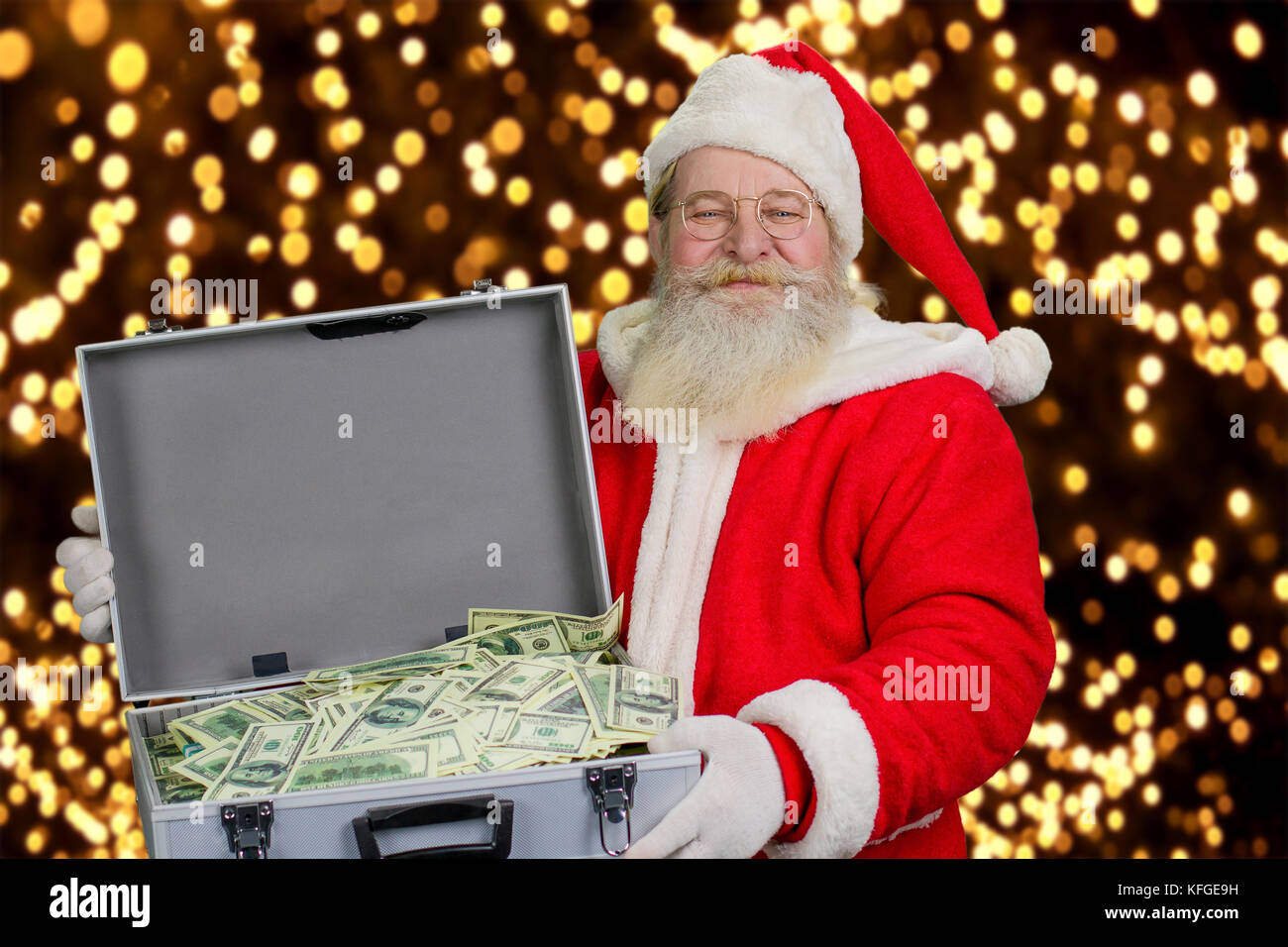 Santa Claus holding case with money. Authentic Santa Claus with open ...