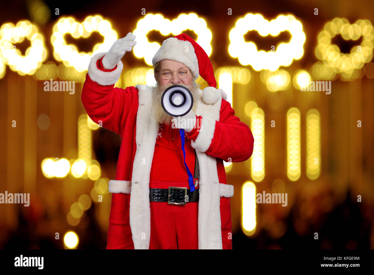 Portrait of Santa Claus using megaphone. Bearded Santa Claus using ...