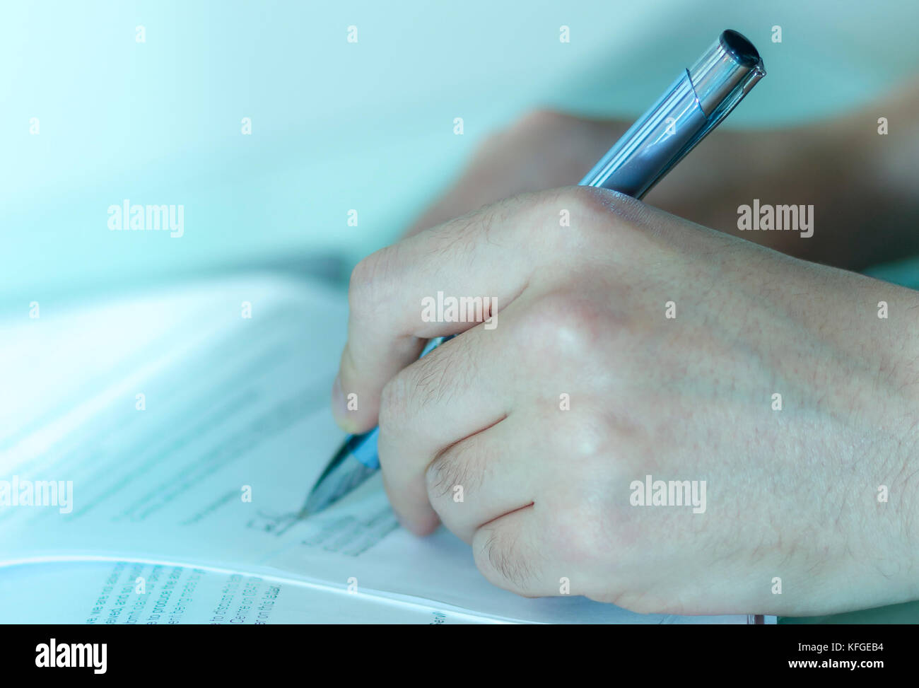 Hand and pen signature closeup Stock Photo - Alamy
