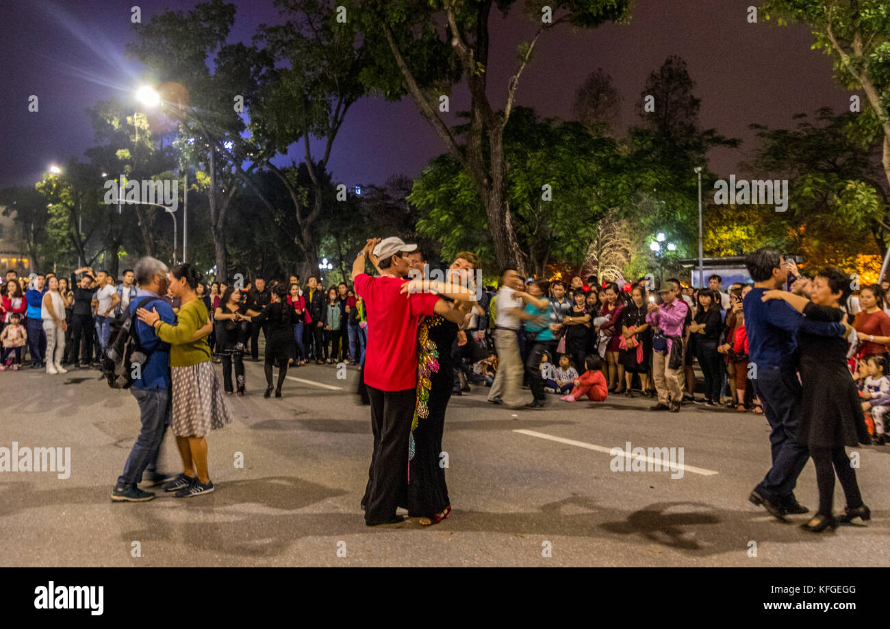 People enjoying themselves dancing in in public in centre of Hanoi ...