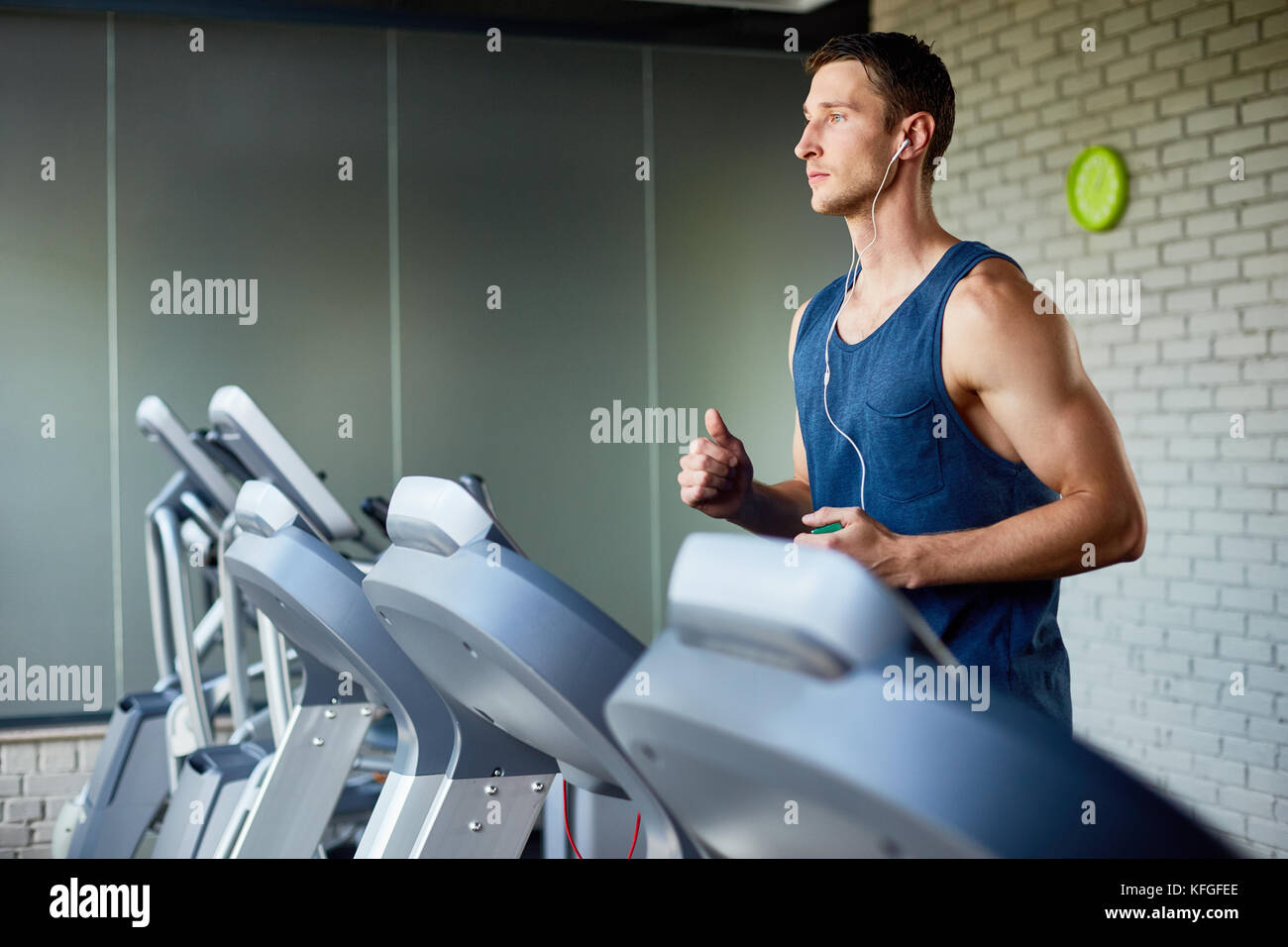Handsome Man Running on Treadmill Stock Photo - Alamy
