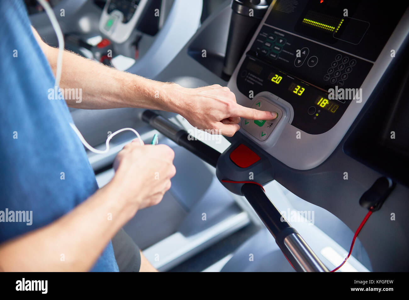 Closeup of Man Setting Machine in Gym Stock Photo - Alamy