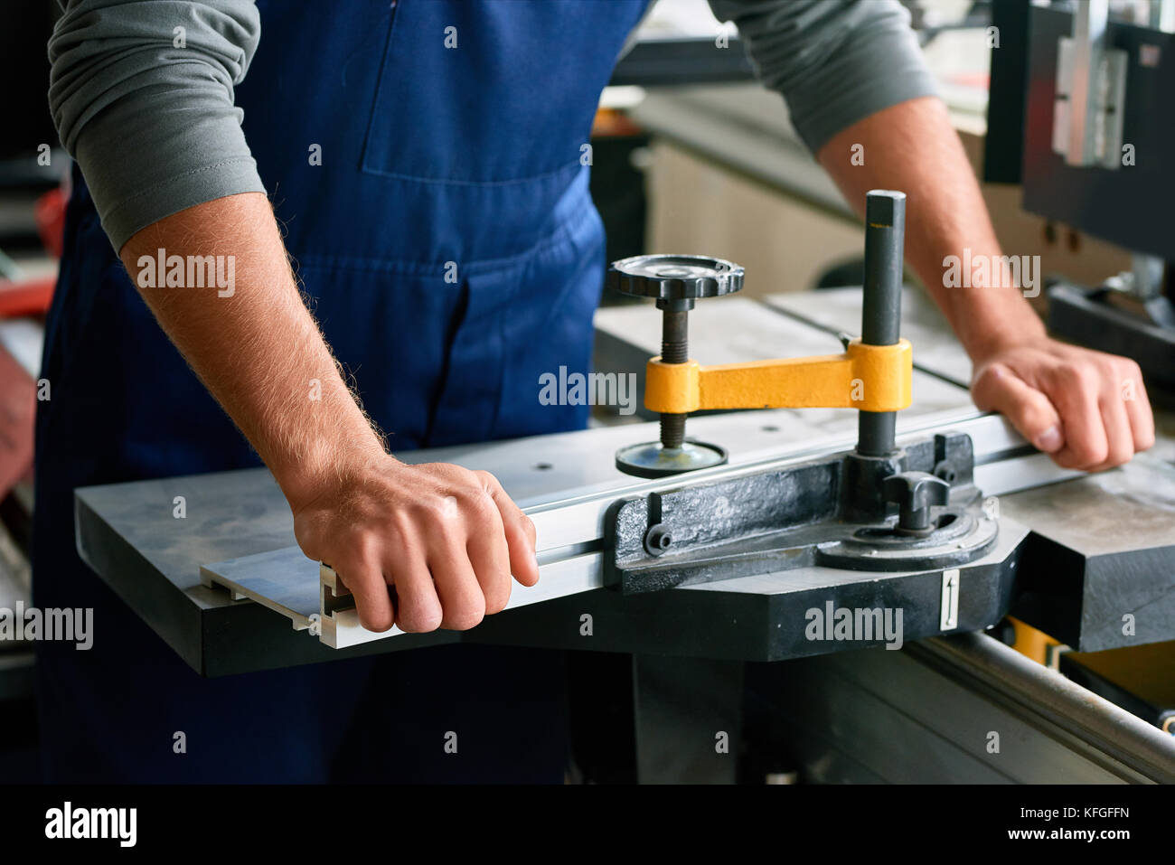 Closeup of Worker Using Metal Cutting Bench Stock Photo - Alamy