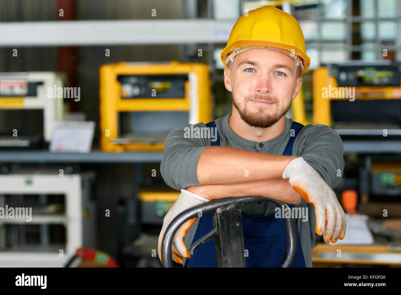 Young Workman Smiling at Camera Stock Photo - Alamy