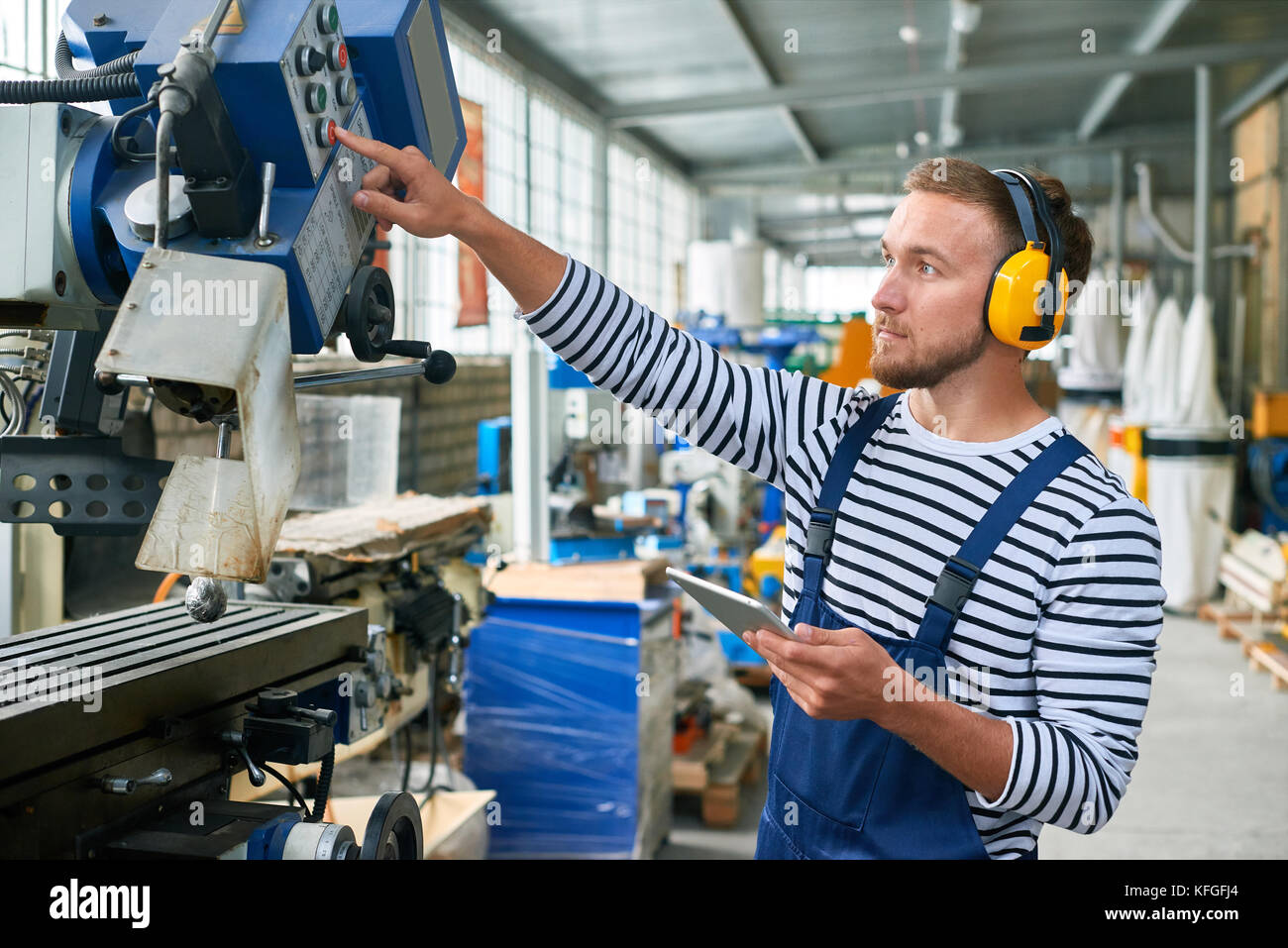 Young Machine Operator at Modern Plant Stock Photo - Alamy