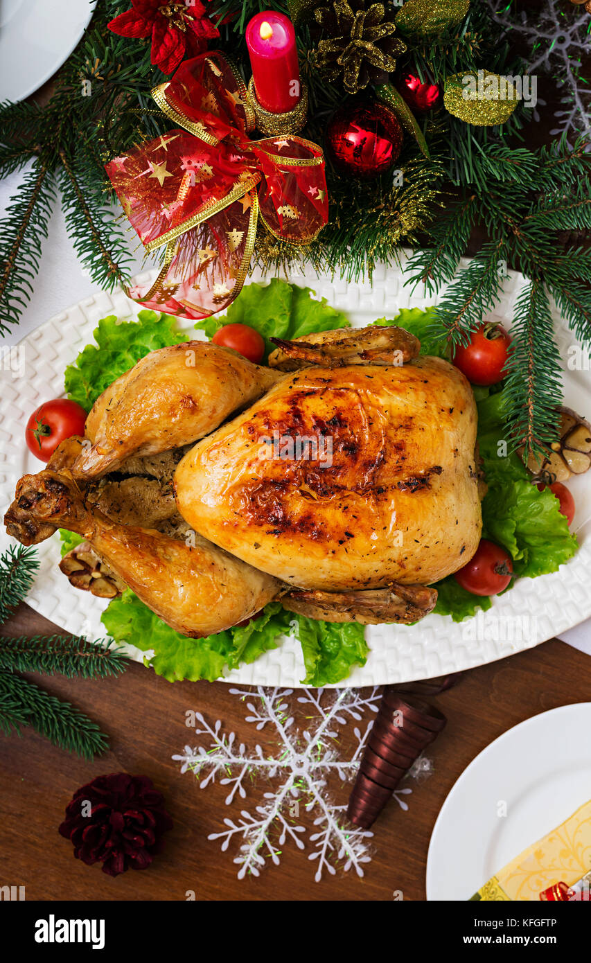 Baked turkey or chicken. The Christmas table is served with a turkey ...