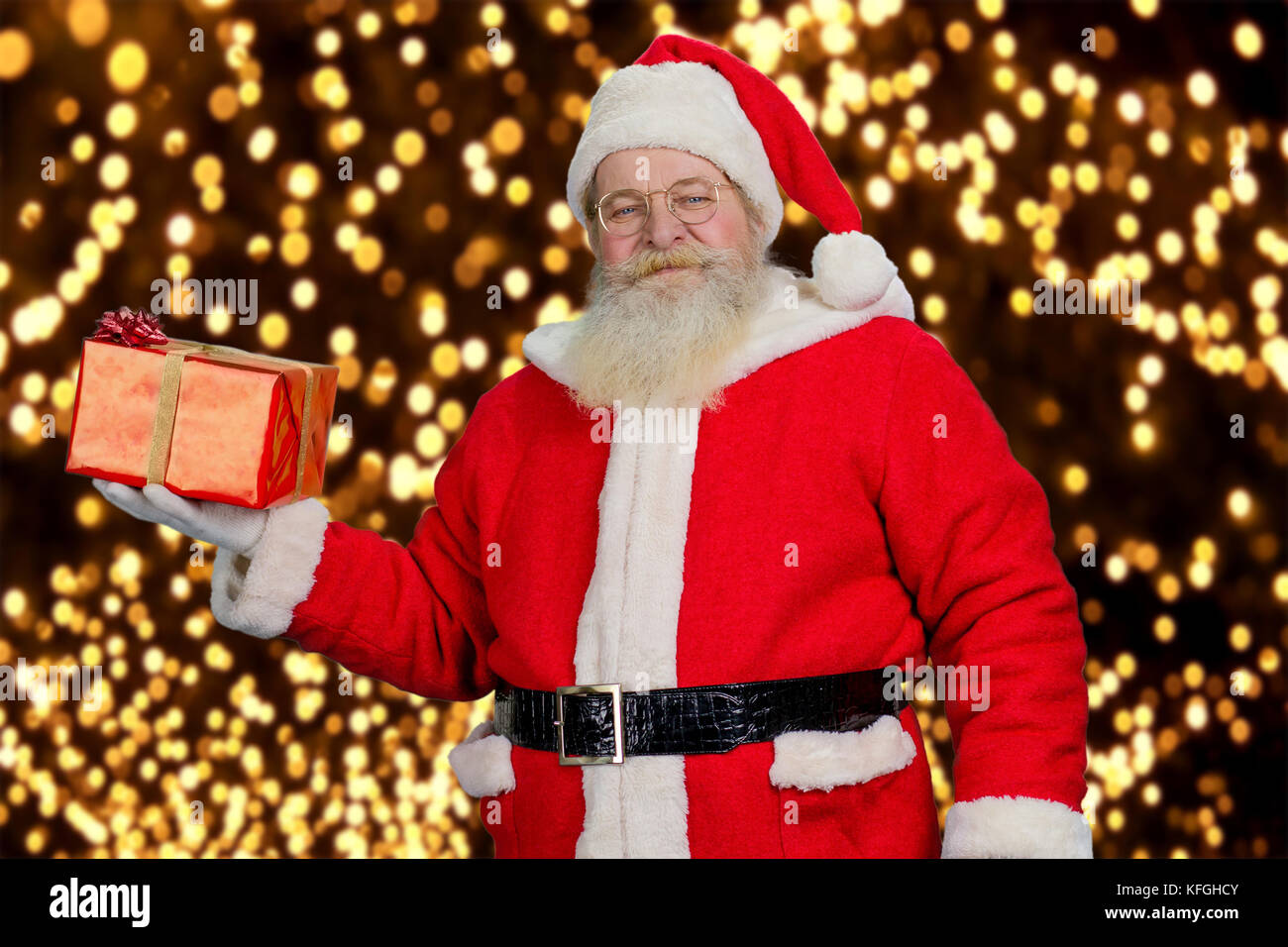 Santa Claus with red gift box. Portrait of authentic Santa Claus ...