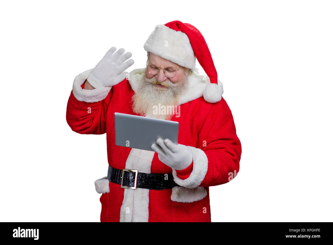 Santa Claus using computer tablet. Santa Claus with real beard holding ...
