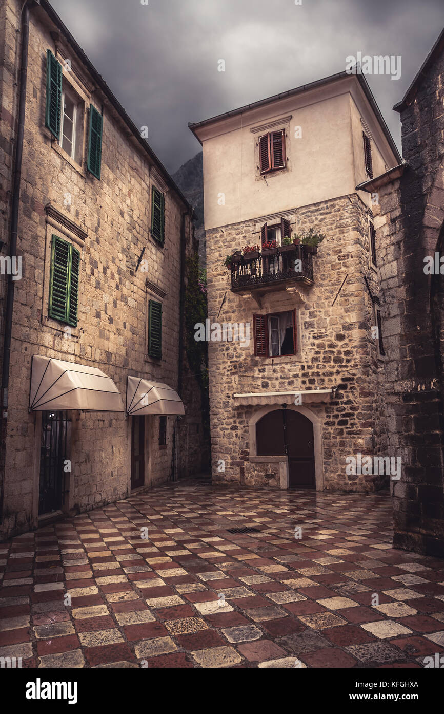 Vintage medieval square with ancient stone pavers with medieval ...