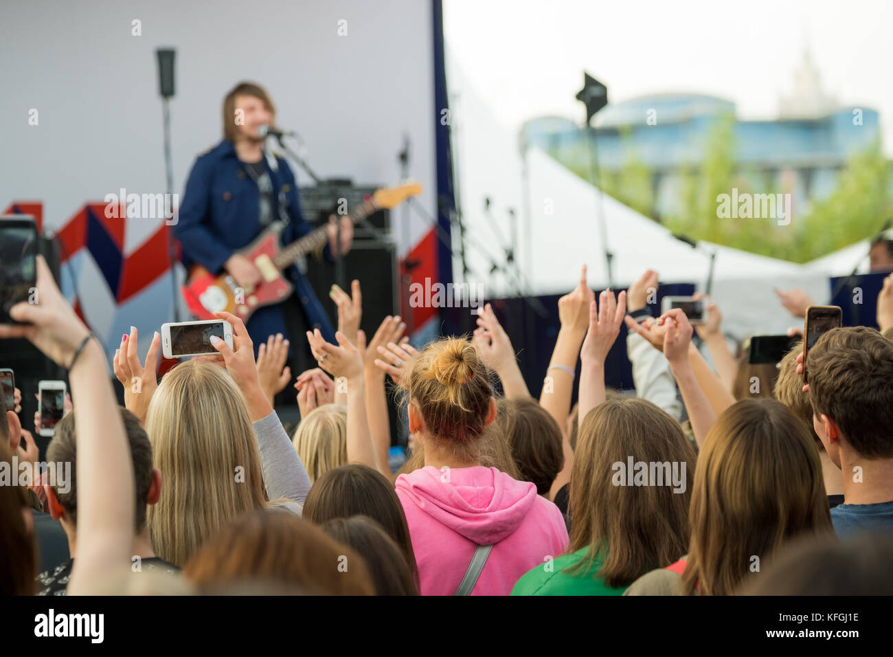 Audience cheering musicians at an open air fest Stock Photo - Alamy