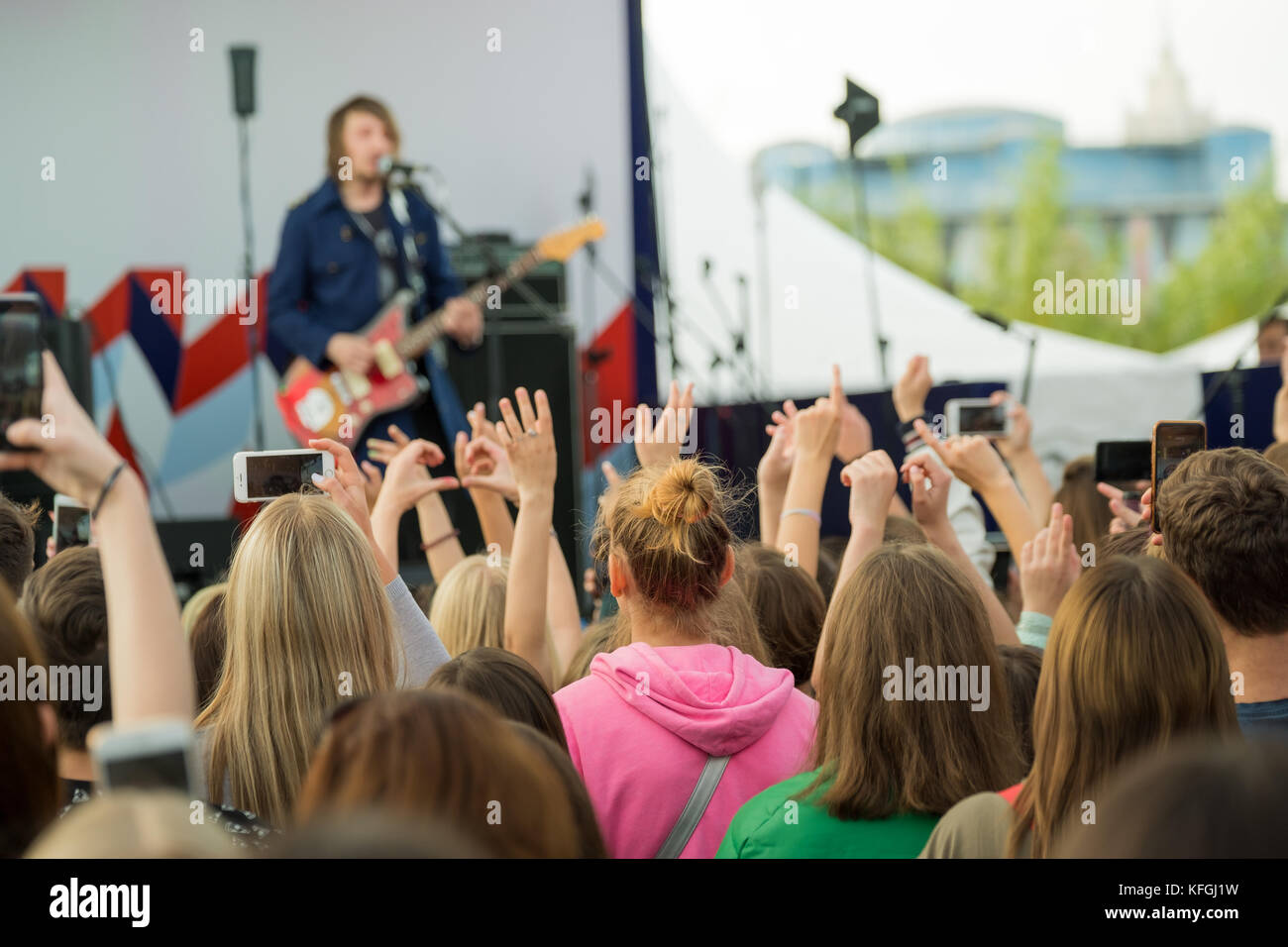 Audience cheering musicians at an open air fest Stock Photo - Alamy