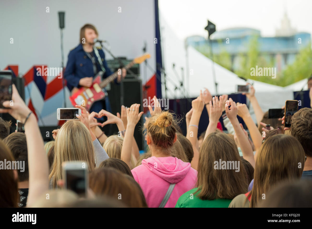 Audience cheering musicians at an open air fest Stock Photo - Alamy