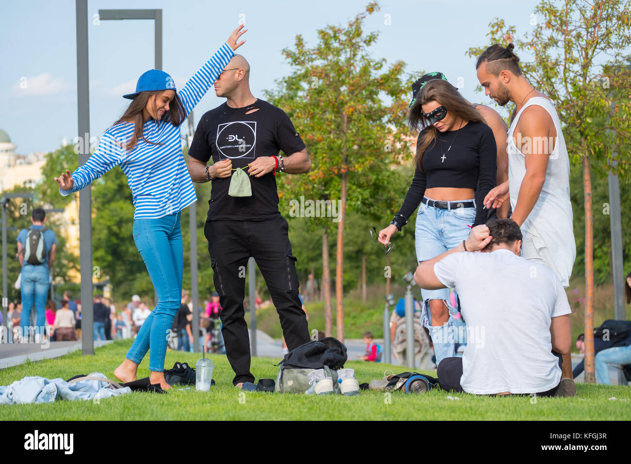 Group of young people having fun in the park at day time Stock Photo ...