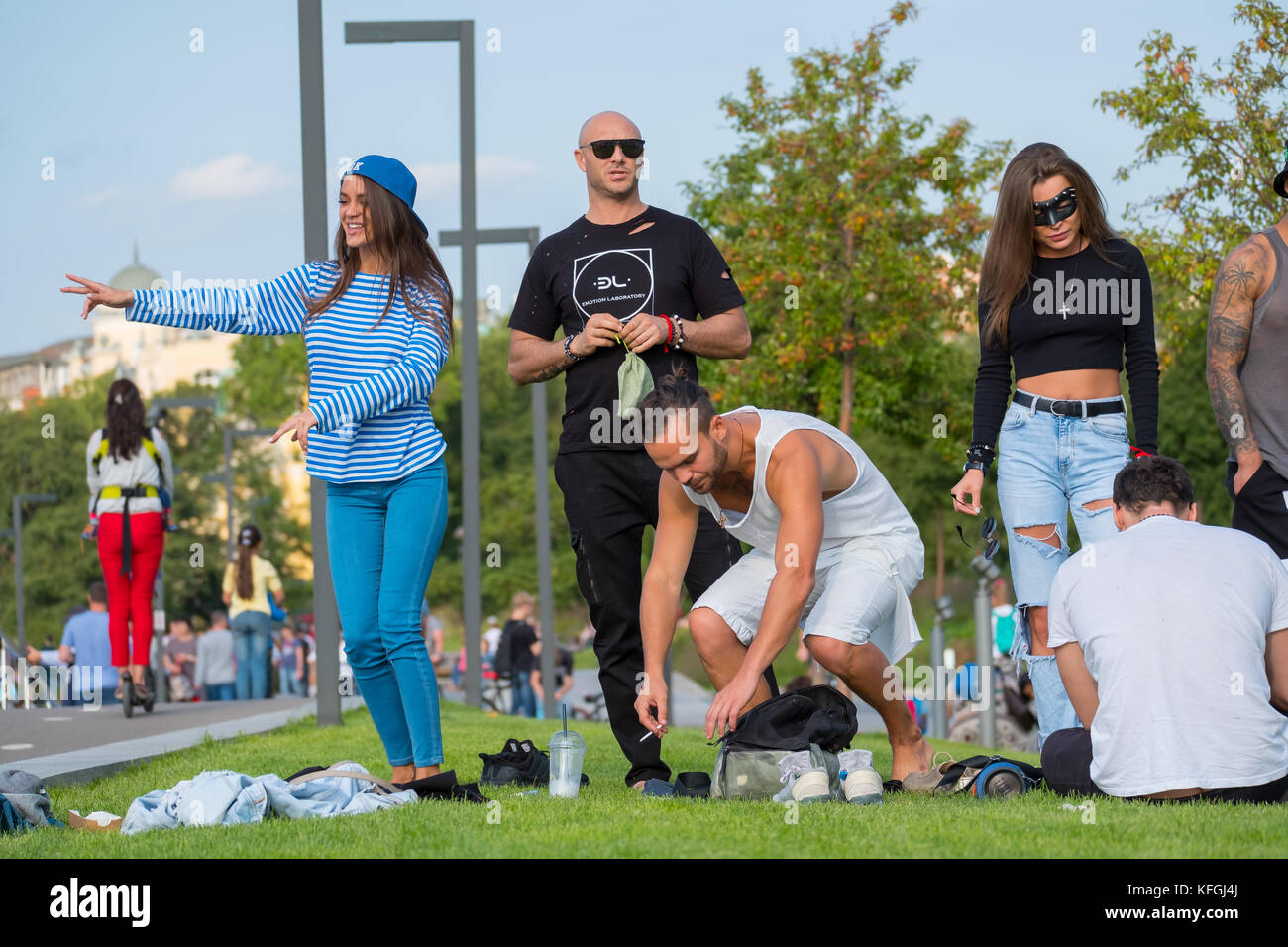 Group of young people having fun in the park at day time Stock Photo ...