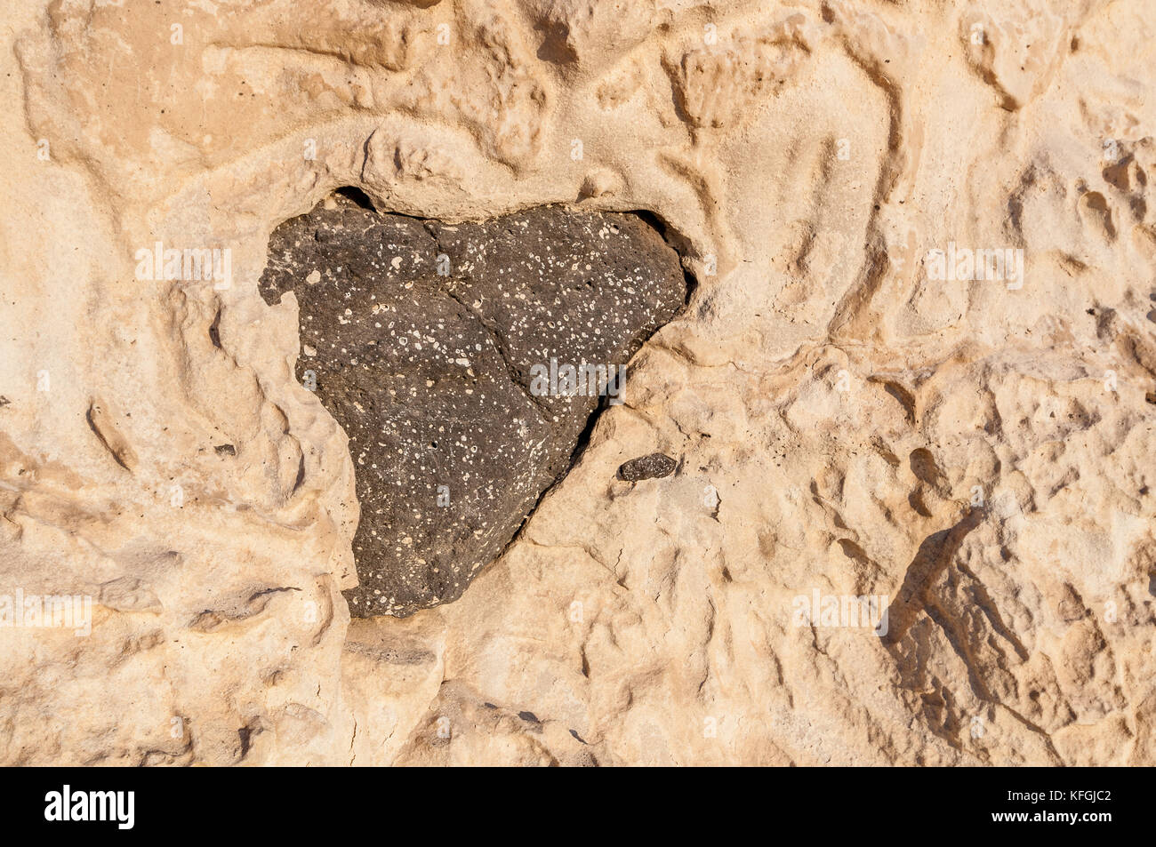 basalt pyroclate in an ancient beach forming a rock. Ajuy ...
