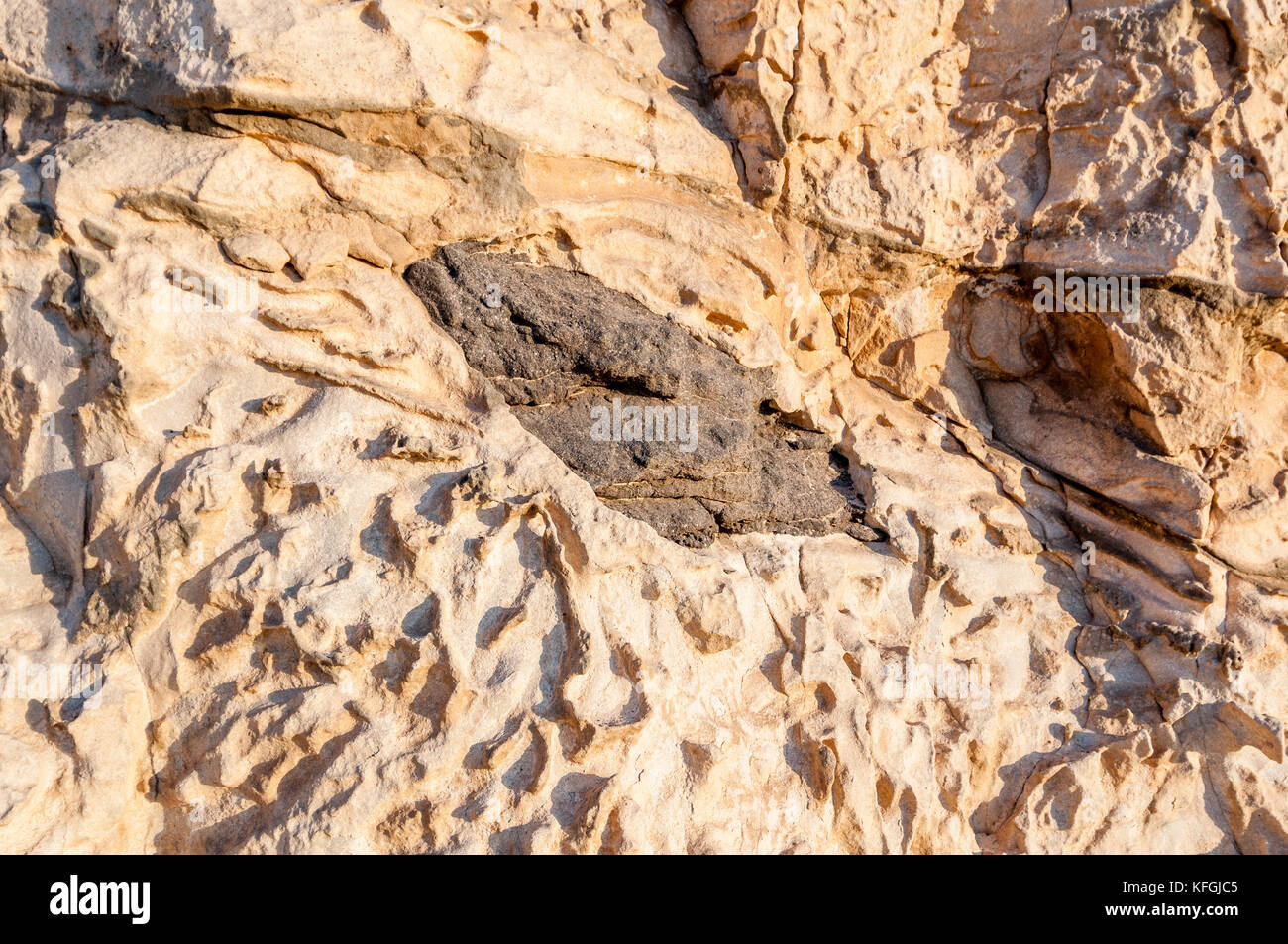 basalt pyroclate in an ancient beach forming a rock. Ajuy ...