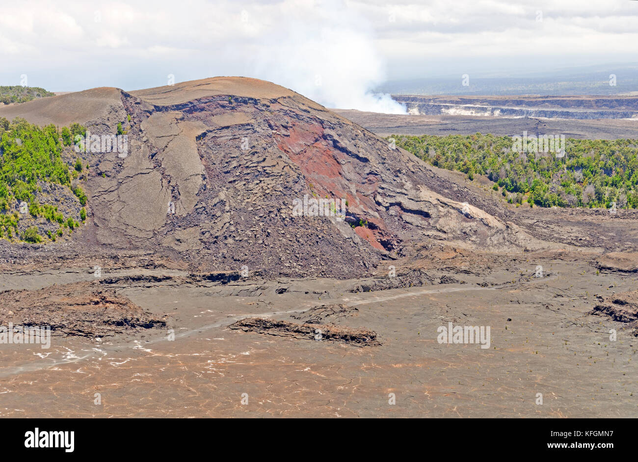 Spatter Cone of Kilauea Iki in Hawaii, with steam from the main volcano ...