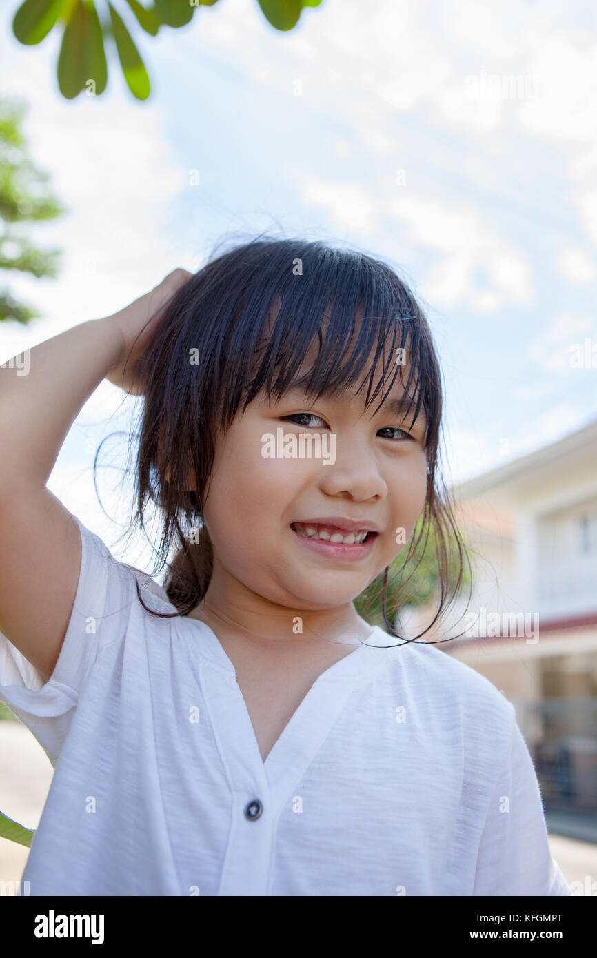 head shot of lovely asian children smiling face outdoor Stock Photo - Alamy
