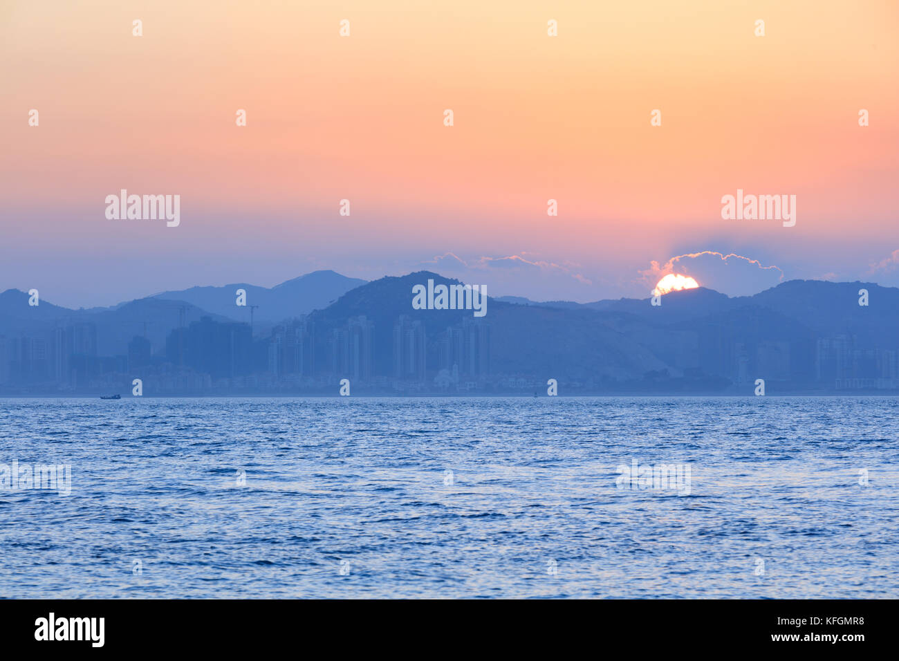 Sunset with sea and mountains in xiamen, China Stock Photo - Alamy