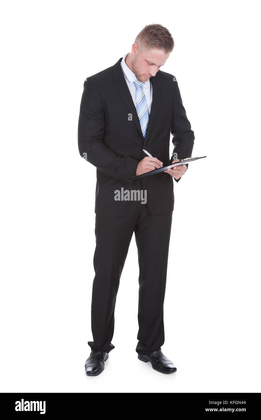 Manager writing report quality control hi-res stock photography and ...