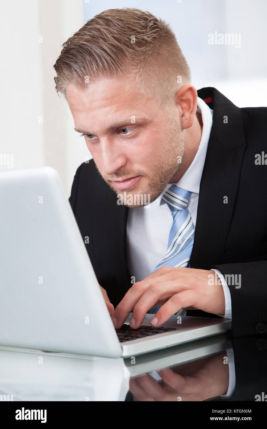 Adult looking at computer screen back hi-res stock photography and ...