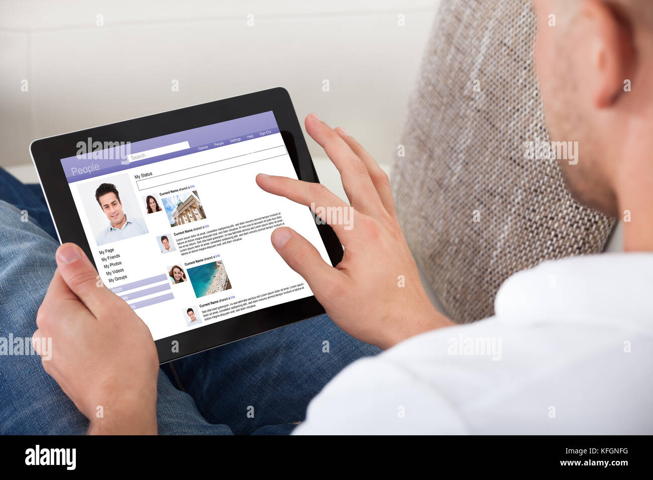 Man looking at personal profiles or comments left by viewers on a ...