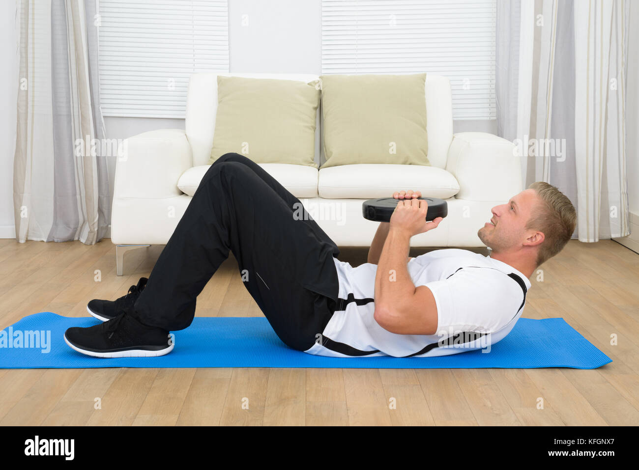Home workout young man hi-res stock photography and images - Alamy