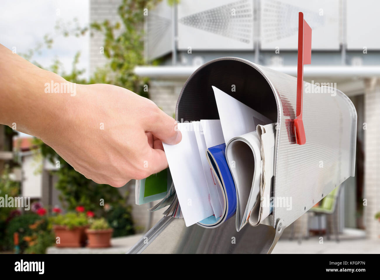 Close-up Of Man's Hand Taking Letter From Mailbox Outside House Stock ...
