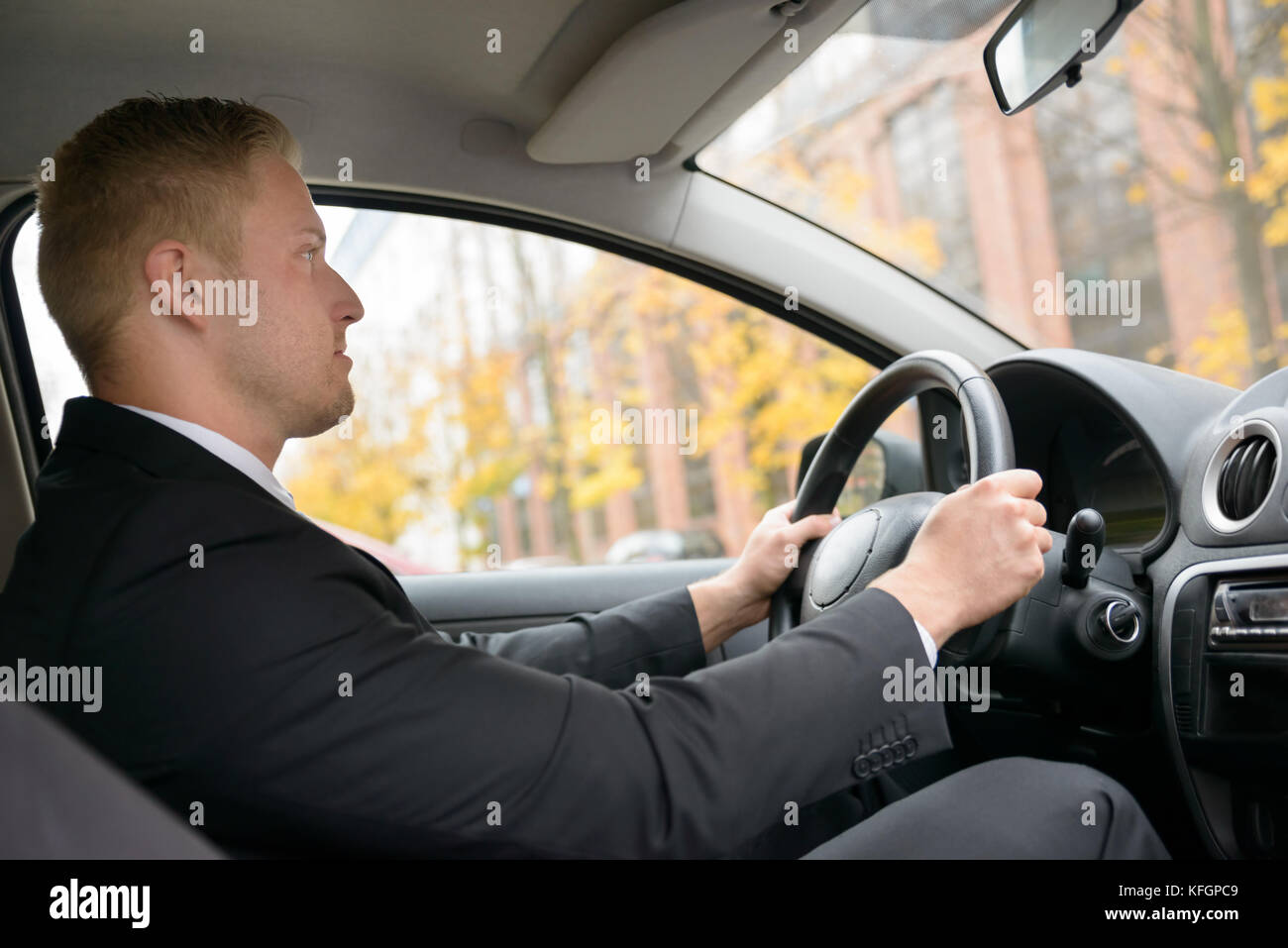 Portrait Of A Young Man Driving Car Stock Photo - Alamy