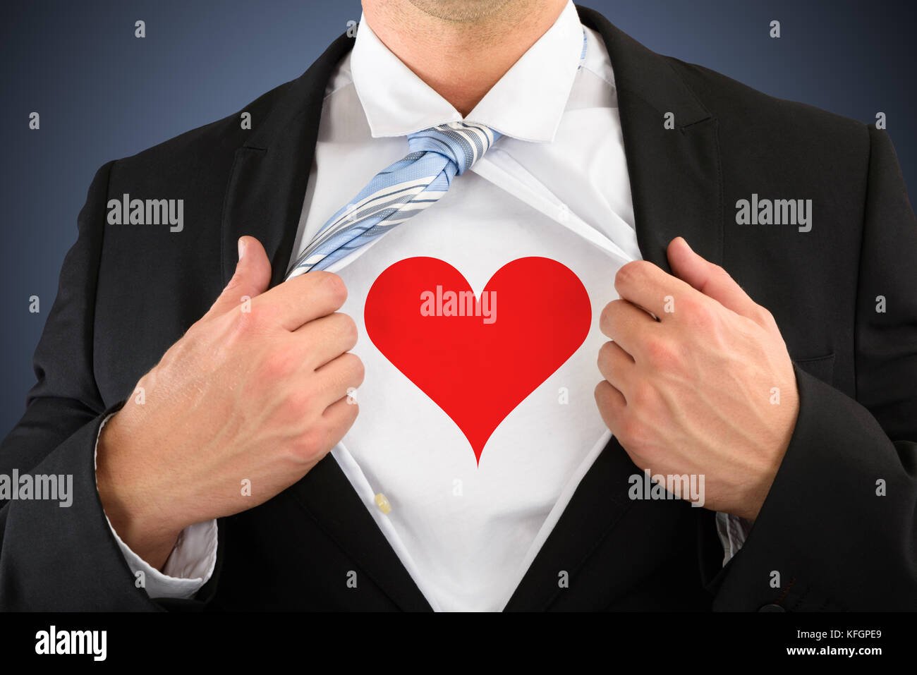 Close-up Of A Businessman Pulling His Shirt Showing Heart Shape Symbol ...