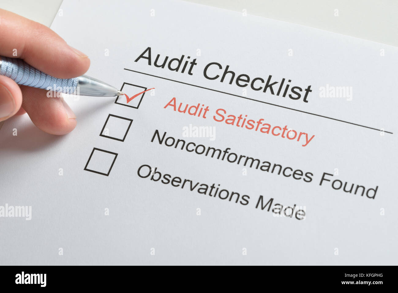 Person Hand Make Tick On Audit Satisfactory In Audit Checklist Paper ...