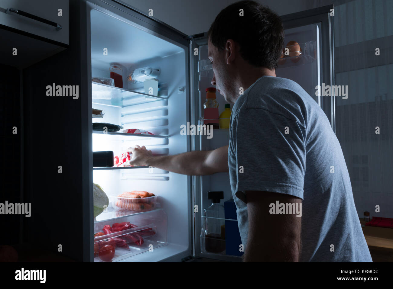 Refrigerator night man hi-res stock photography and images - Alamy