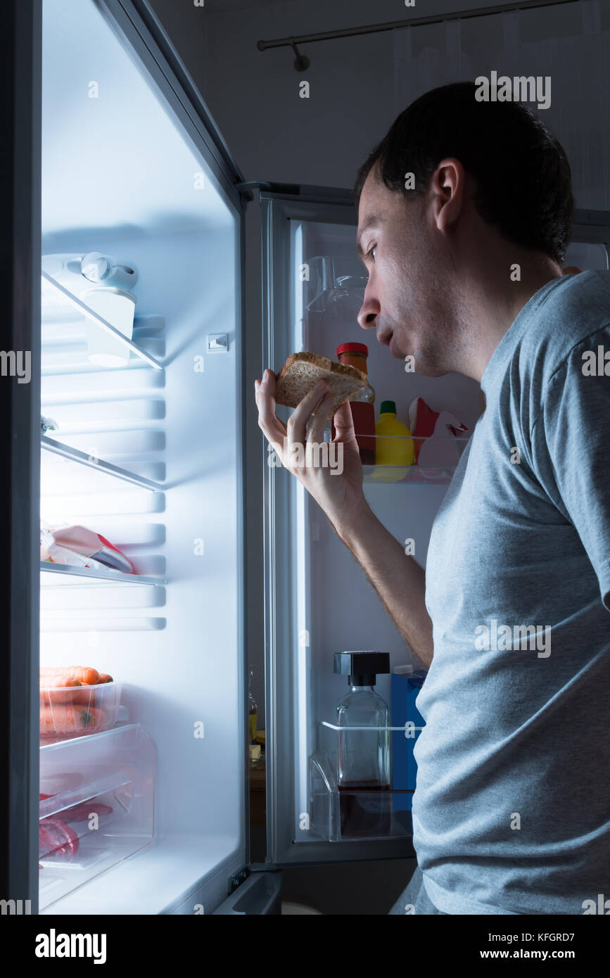 Man eating with bread hi-res stock photography and images - Alamy